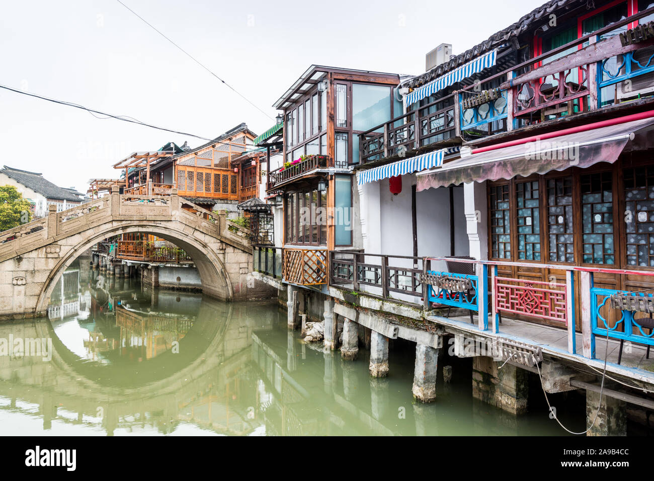 Stone bridge and old buildings in Zhujiajiao, an ancient water town in ...