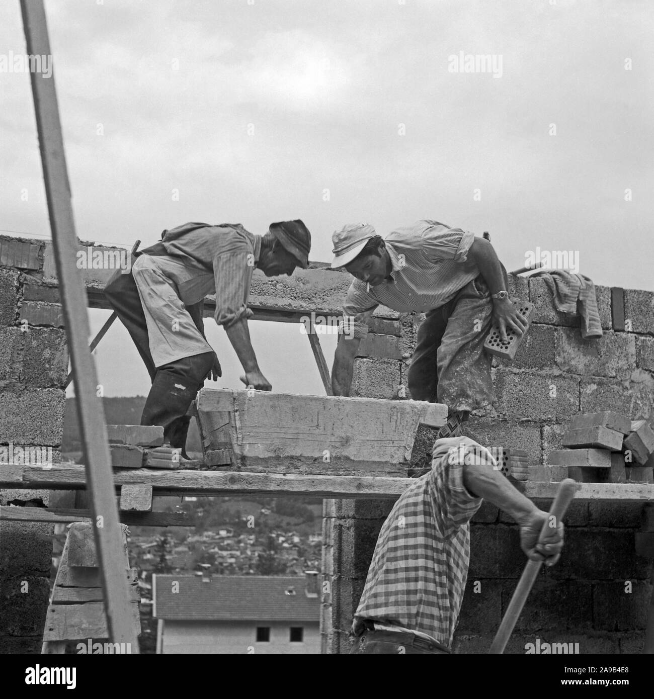 Men building a house near Mittenwald, Germany 1959 Stock Photo - Alamy