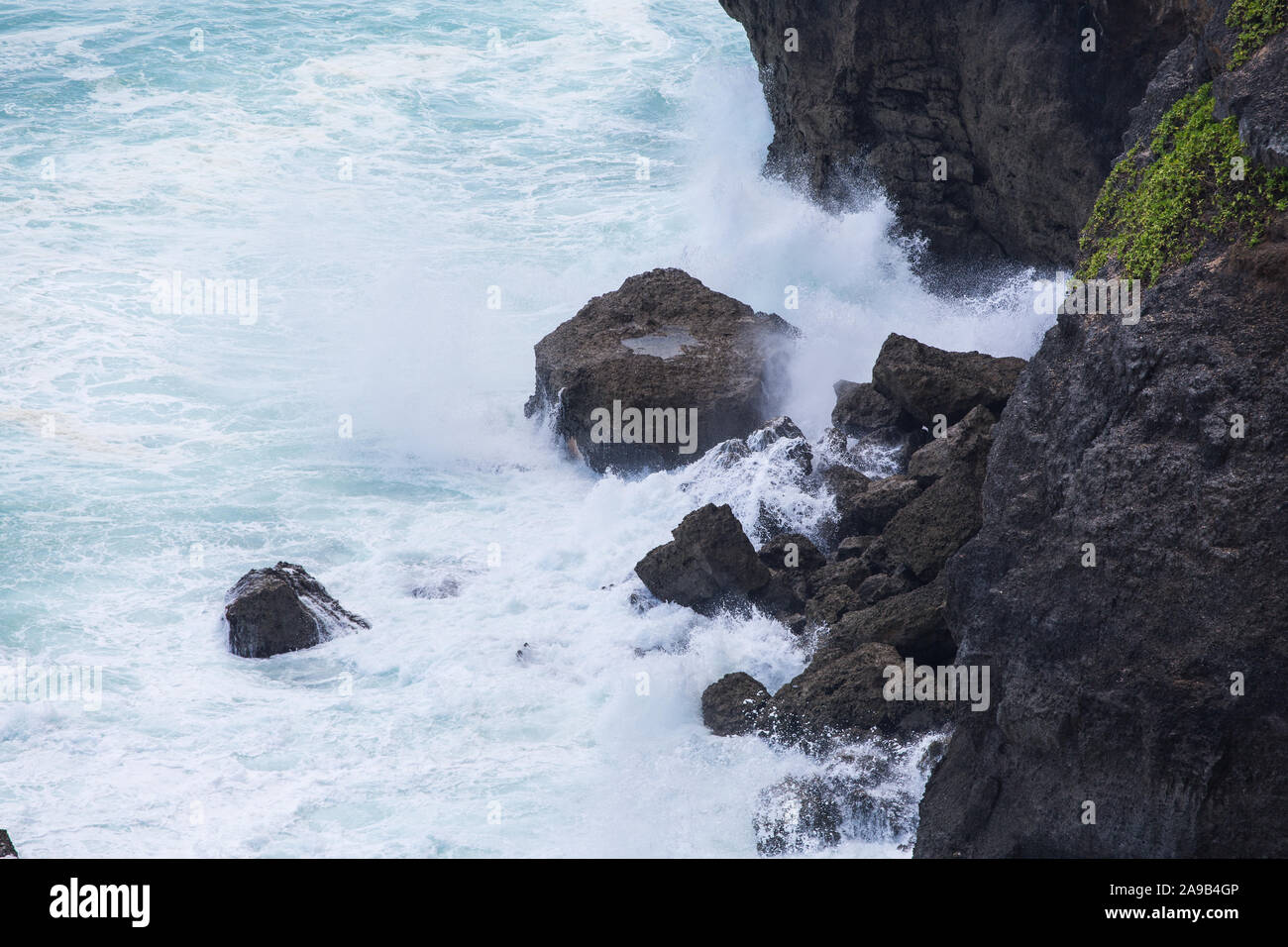 Strong wave hitting the rocks and cliffs, Bali, Indonesia Stock Photo ...