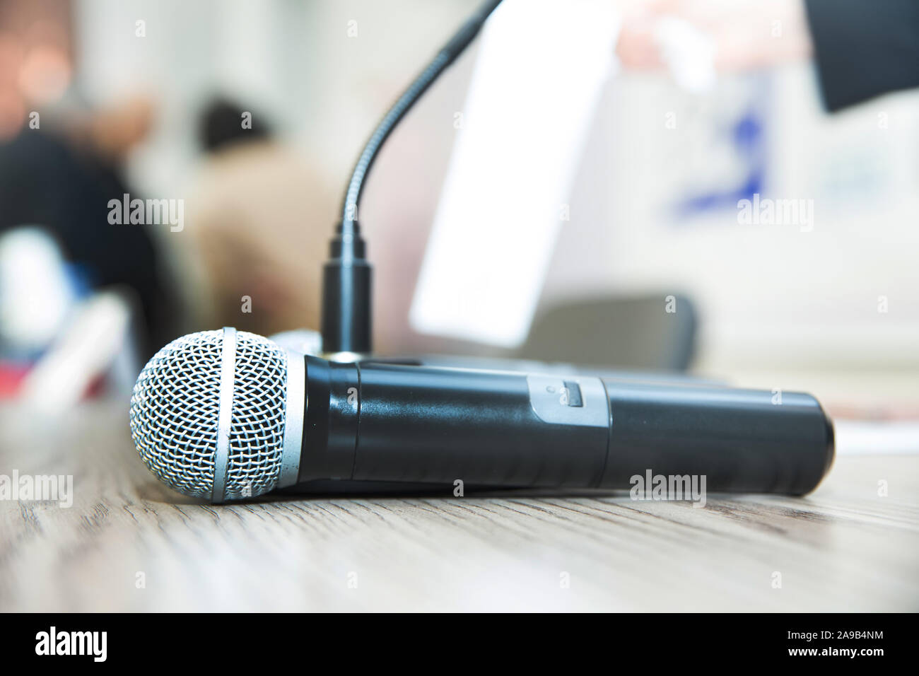 wireless microphones on the conference table. silver microphones ...