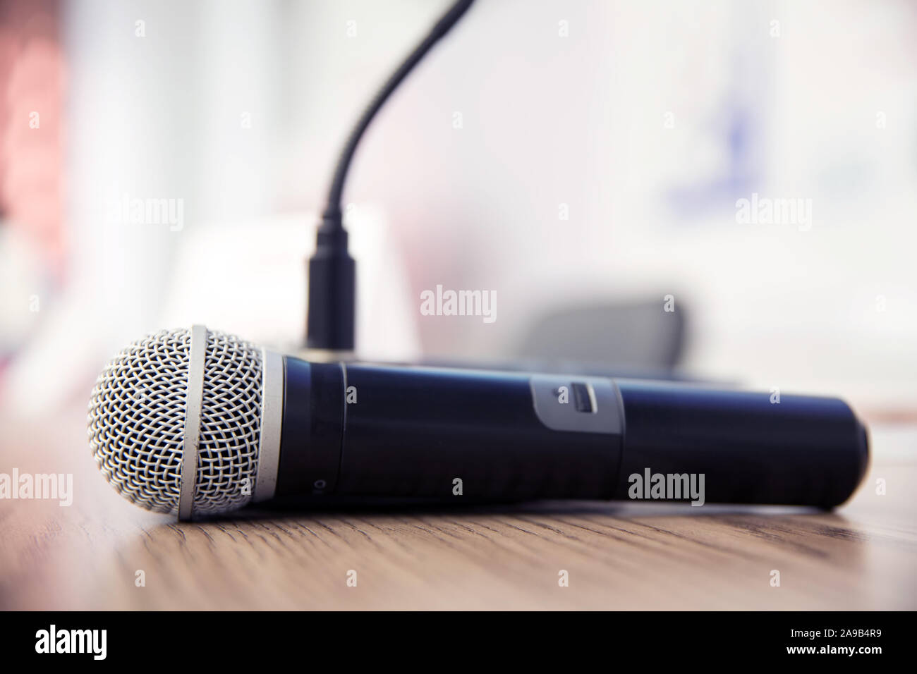 wireless microphones on the conference table. silver microphones ...