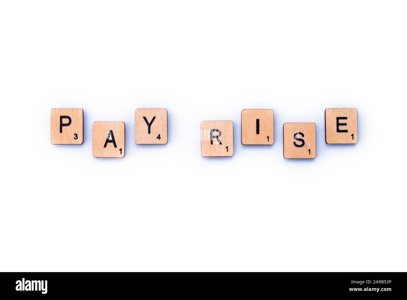 London, UK - February 6th 2019: PAY RISE, spelt out with wooden letter ...