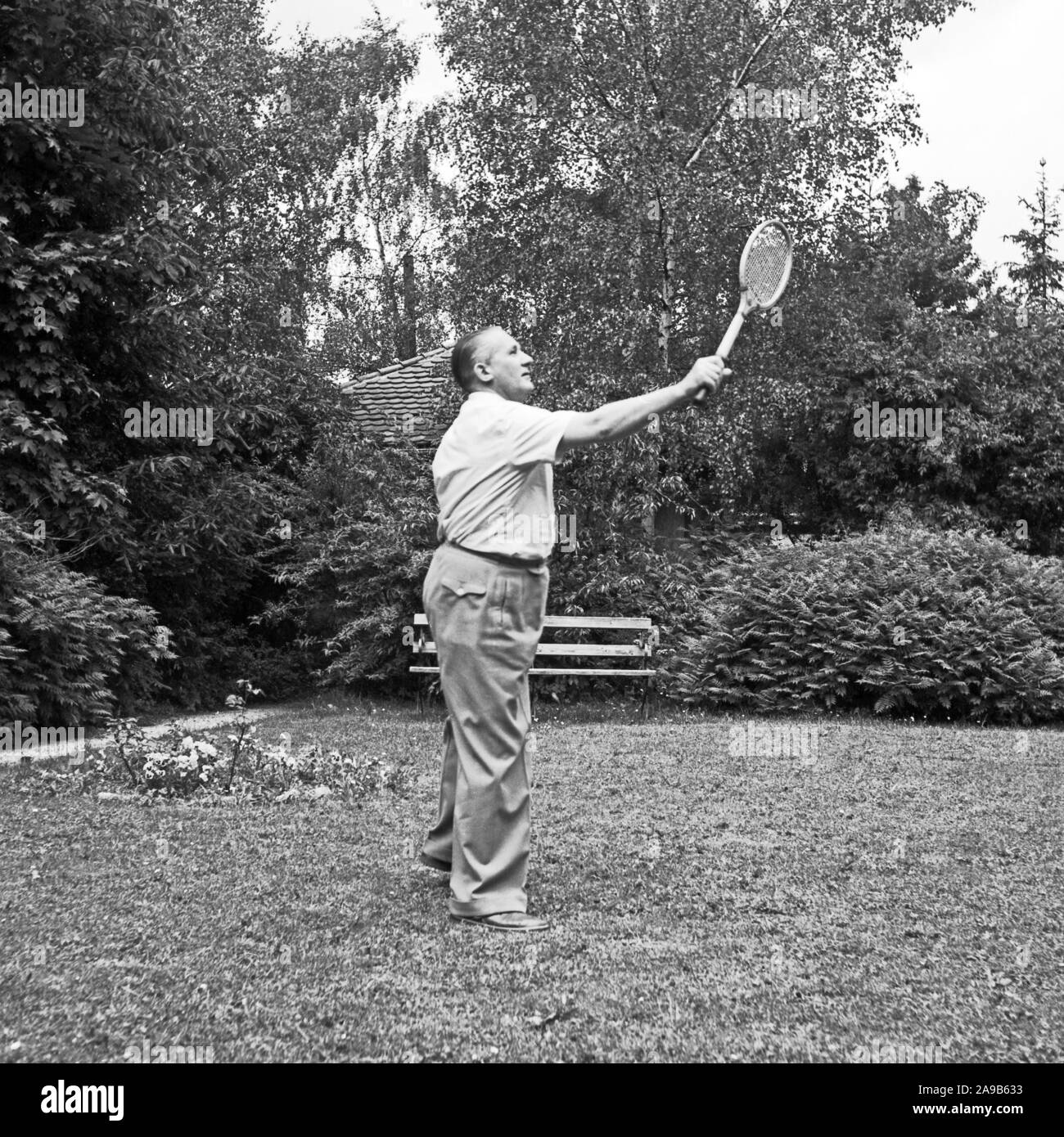 Playing shuttlecock in the garden, Germany 1957 Stock Photo - Alamy