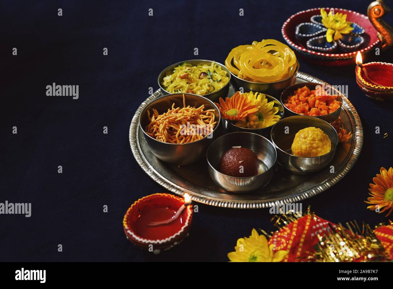 Homemade Diwali foods- snacks and desserts on festive background Stock ...