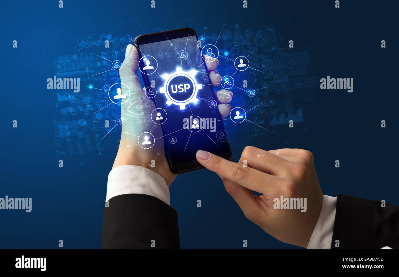 Female hand holding smartphone with USP abbreviation, modern technology ...