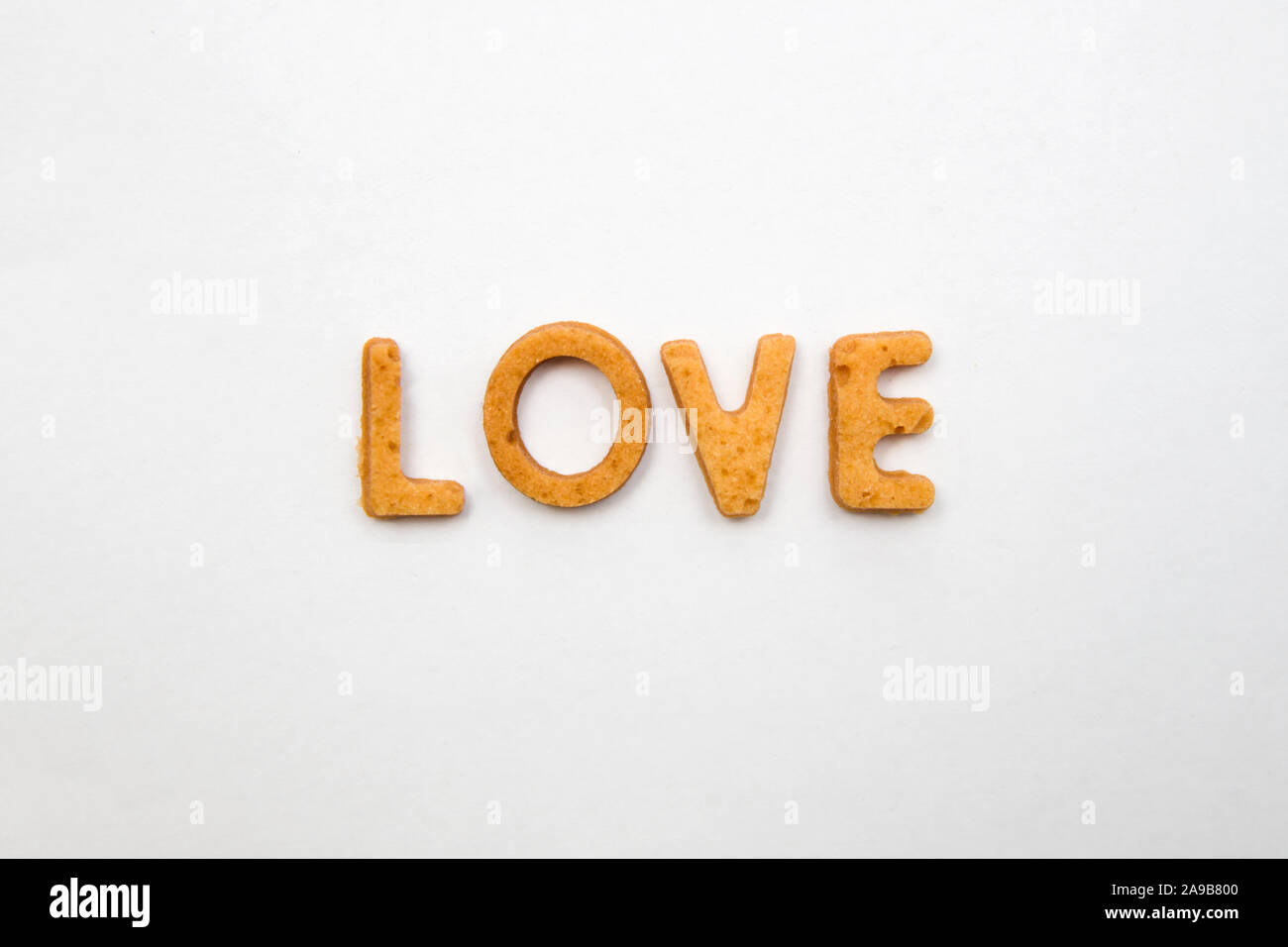 Alphabet cake letters with text Love, isolated on the white background ...