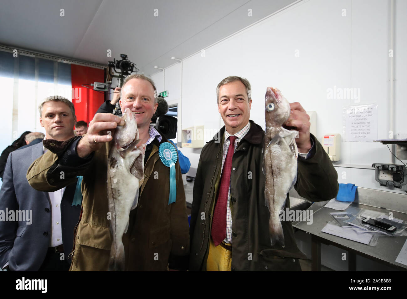 Nigel Farage holding a fish with local Brexit Party candidate ...