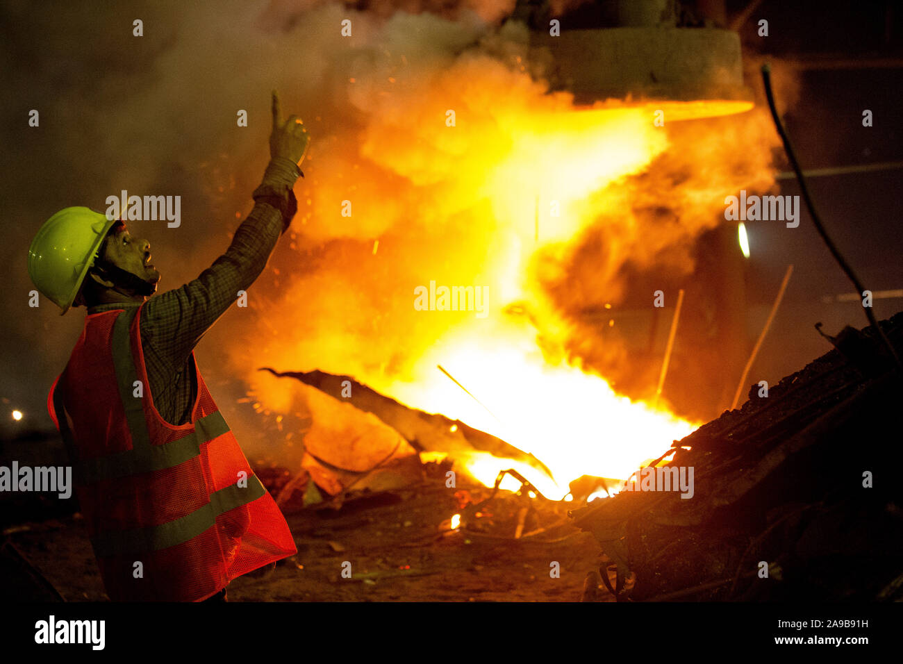 Bangladesh – May 19, 2015: From metal scrap to iron rod making steel ...