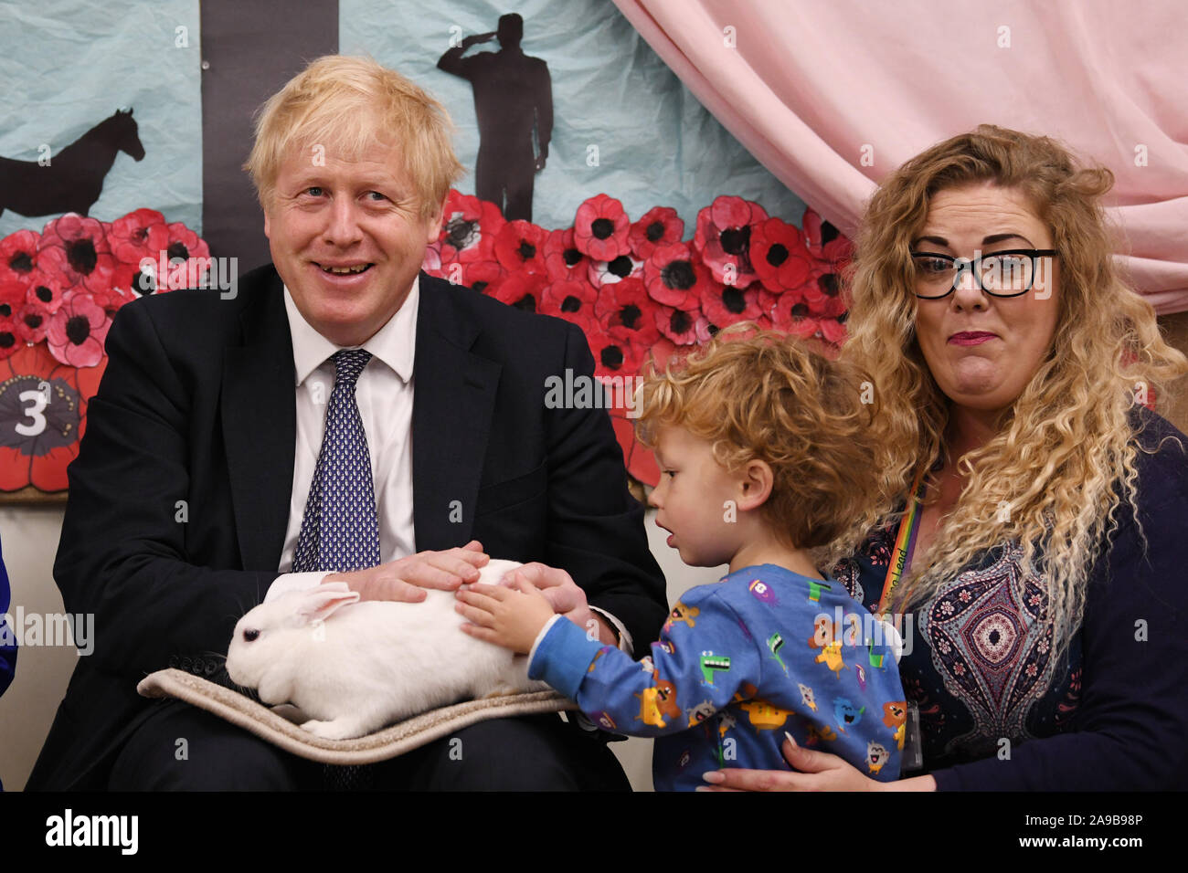 Prime Minister Boris Johnson holding a rabbit during a visit to West ...