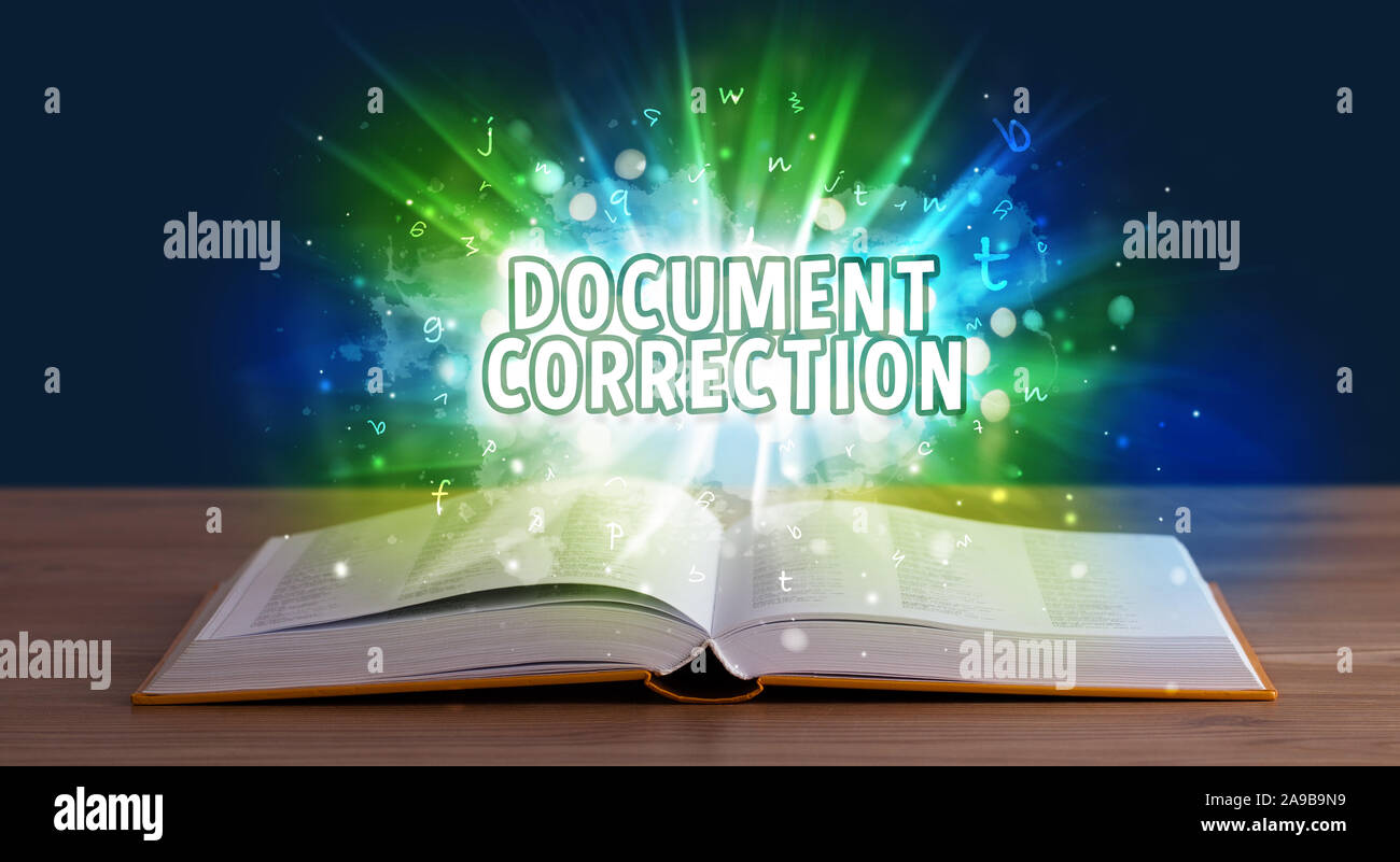 DOCUMENT CORRECTION inscription coming out from an open book ...