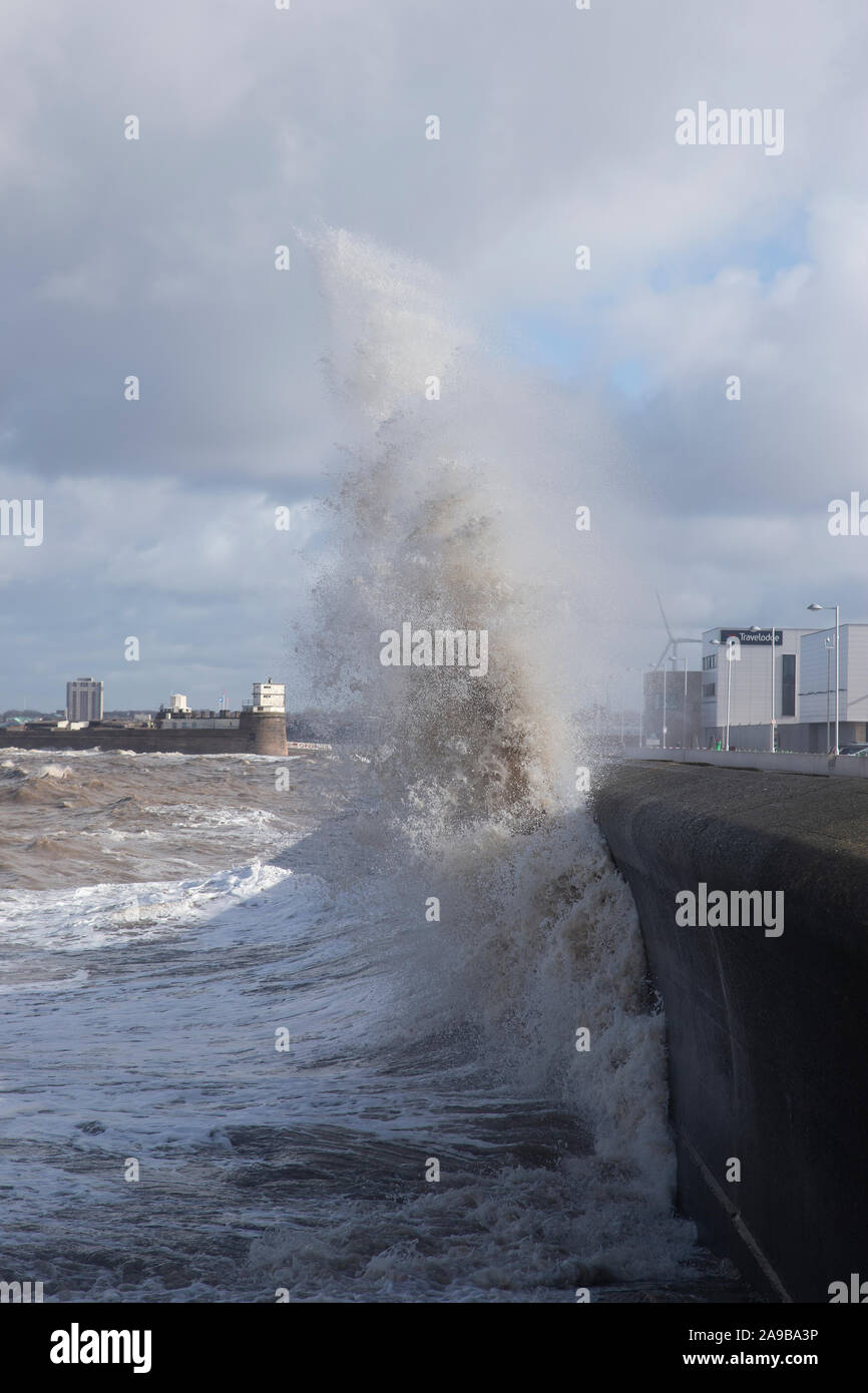 High tides and heavy storms lash the promenade at New Brighton on the ...