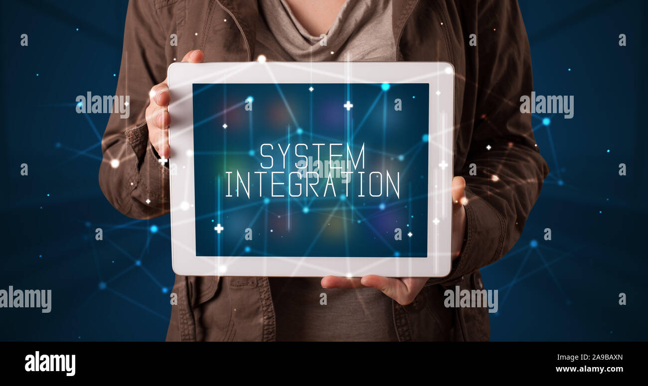 Young business person working on tablet and shows the digital sign ...