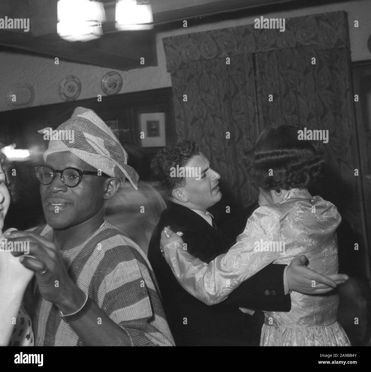 1950s, historical, post-ww2, party, people dancing indoors at a party ...