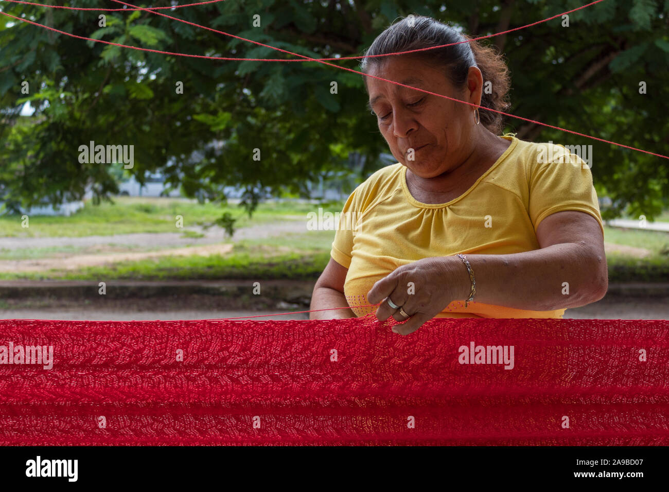 YUCATAN, MEXICO. OCT 22 2017. Mayan woman working on hammock. Weaving ...