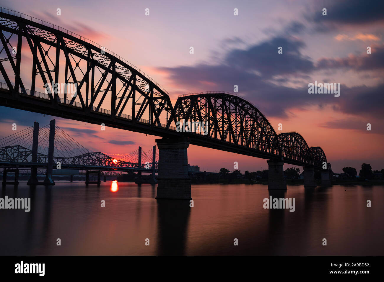 A long exposure sunset of the Big Four Bridge, which is a walking ...