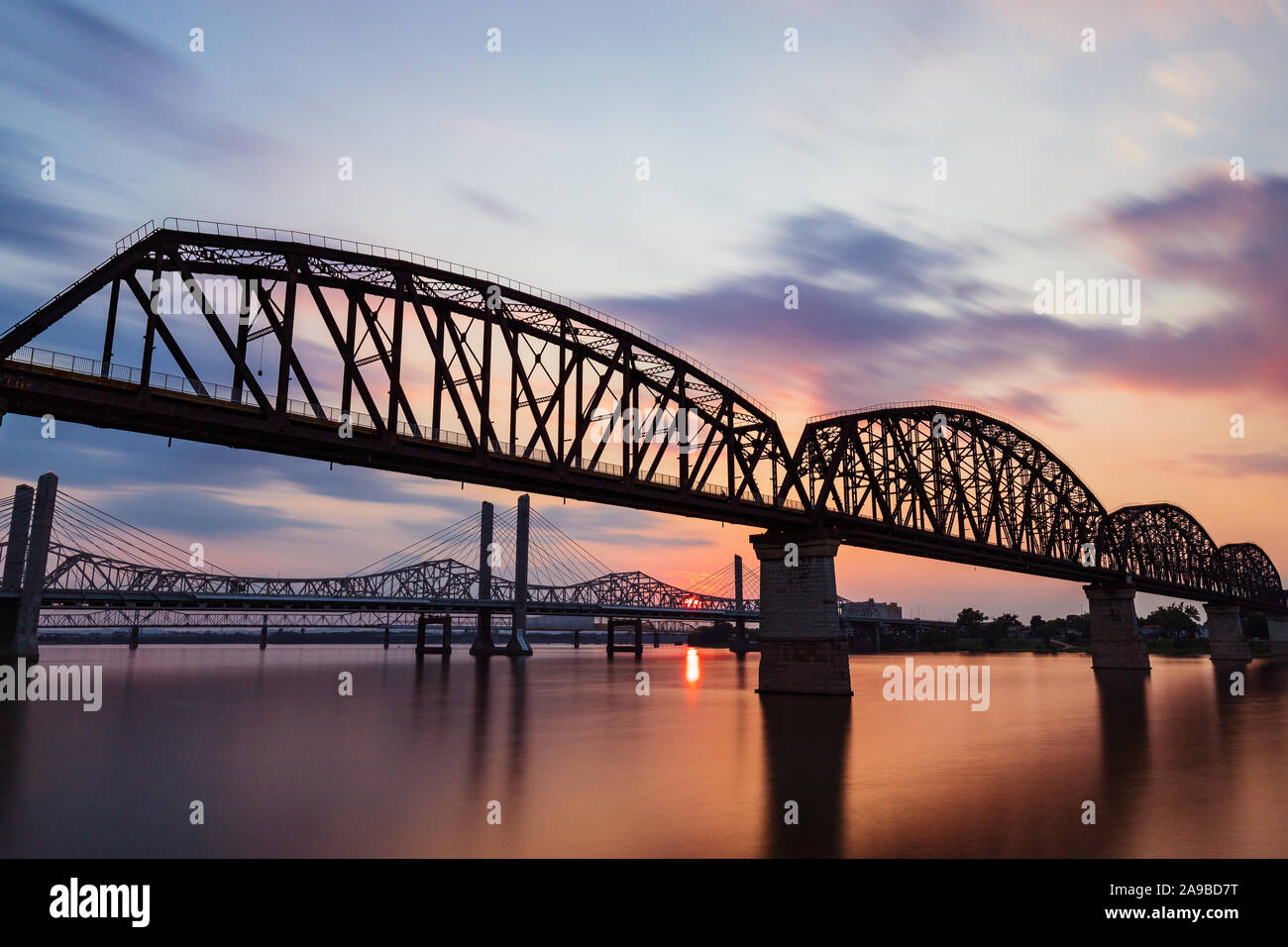 A long exposure sunset of the Big Four Bridge, which is a walking ...