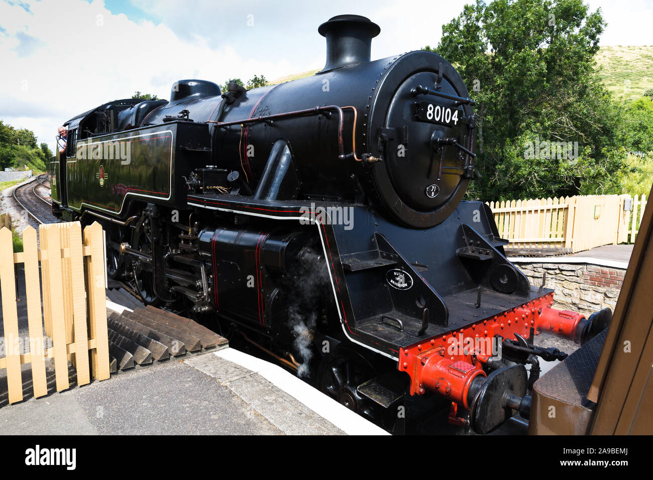 BR Standard class 4 tank engine 80104 steam train arriving Corfe castle ...