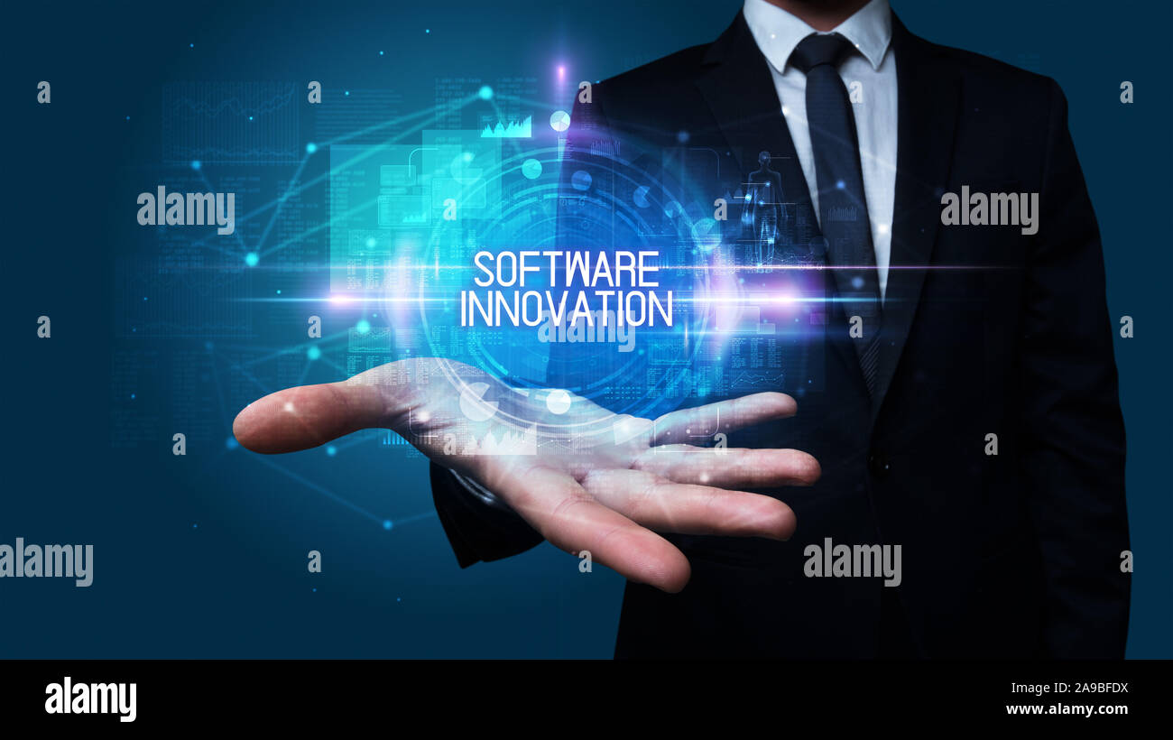 Man hand holding SOFTWARE INNOVATION inscription, technology concept ...