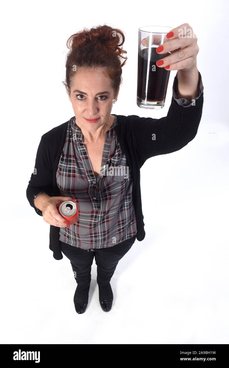 woman with a glass of coke soda on white background Stock Photo - Alamy
