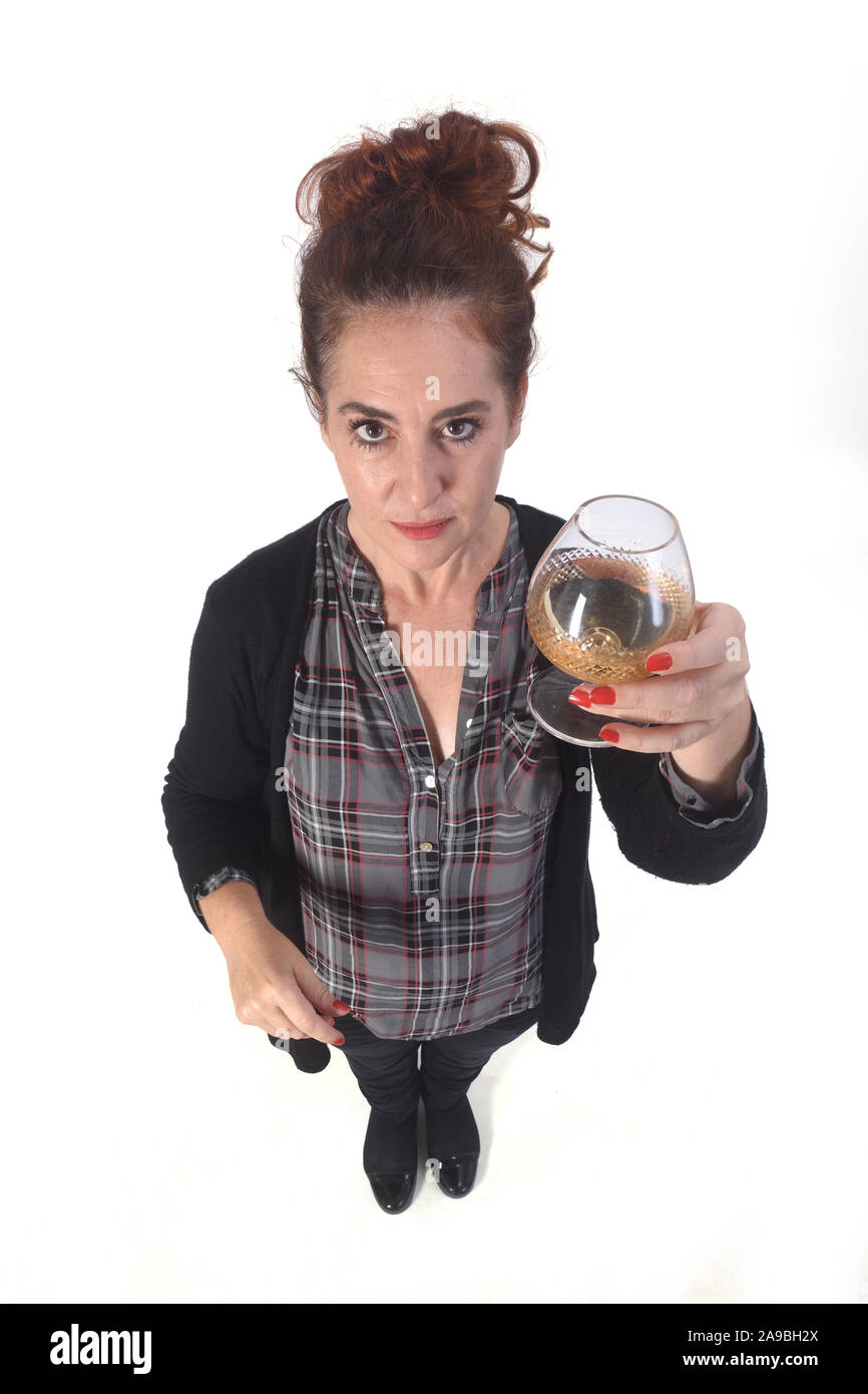 woman with a cup of alcohol on white background Stock Photo - Alamy