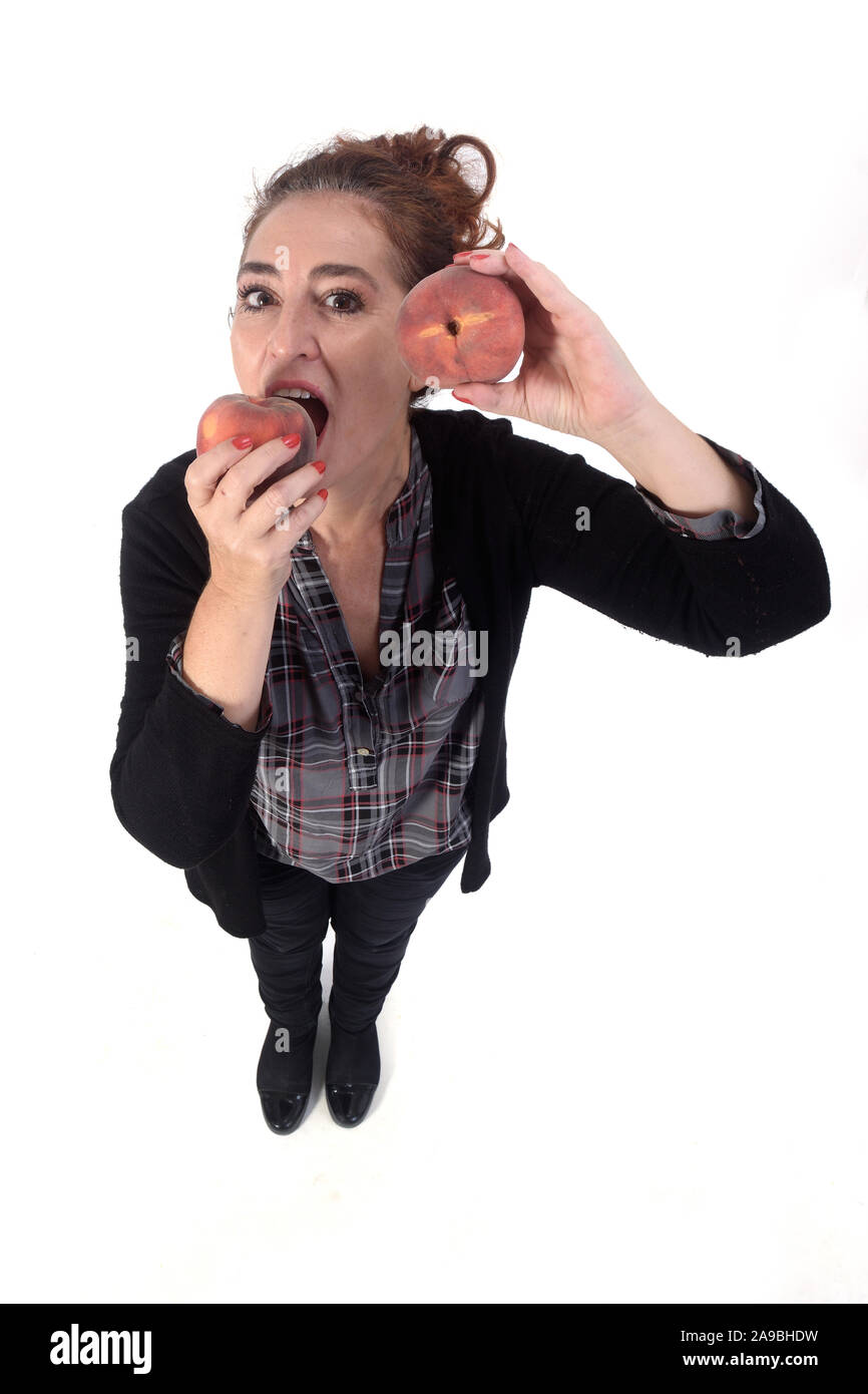 woman with peach on white background Stock Photo - Alamy