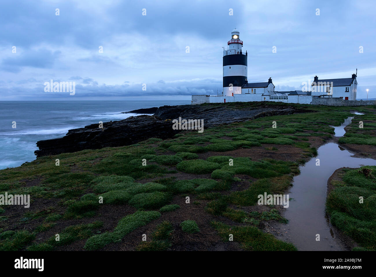 Black and white lighthouse in ireland hi-res stock photography and ...
