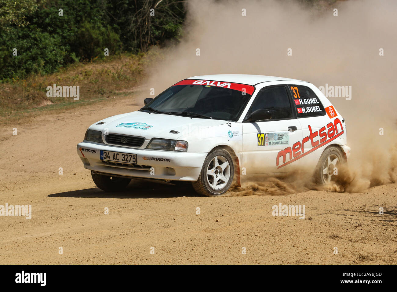 ISTANBUL, TURKEY - JULY 06, 2019: Hakan Gurel drives Suziki Baleno in ...