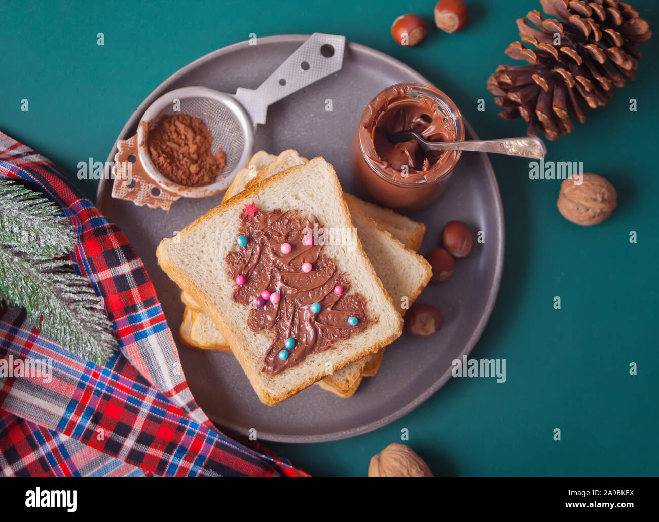 Bread toast with chocolate cream butter with Christmas tree on the ...
