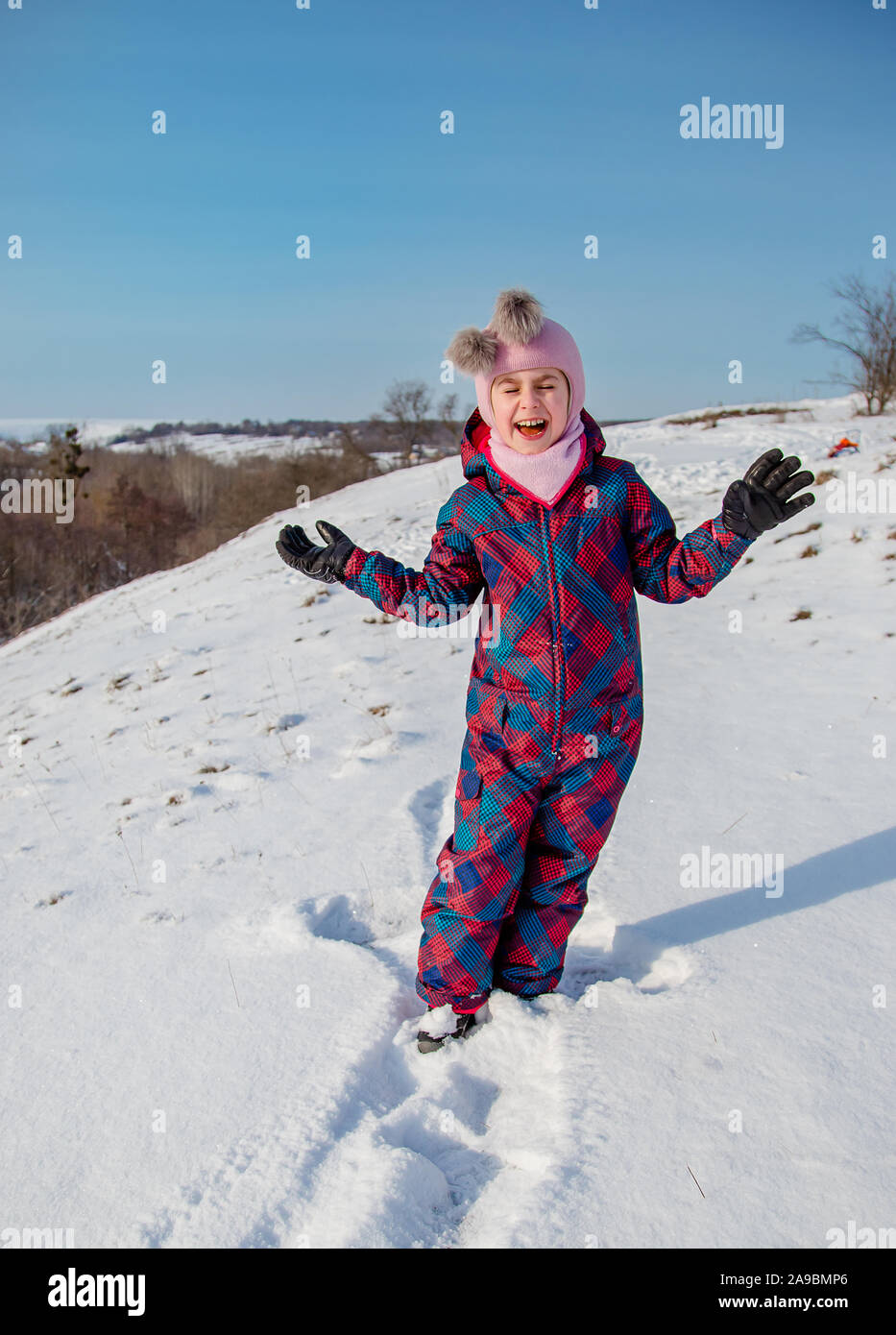 Happy child playing snowball in hi-res stock photography and images - Alamy
