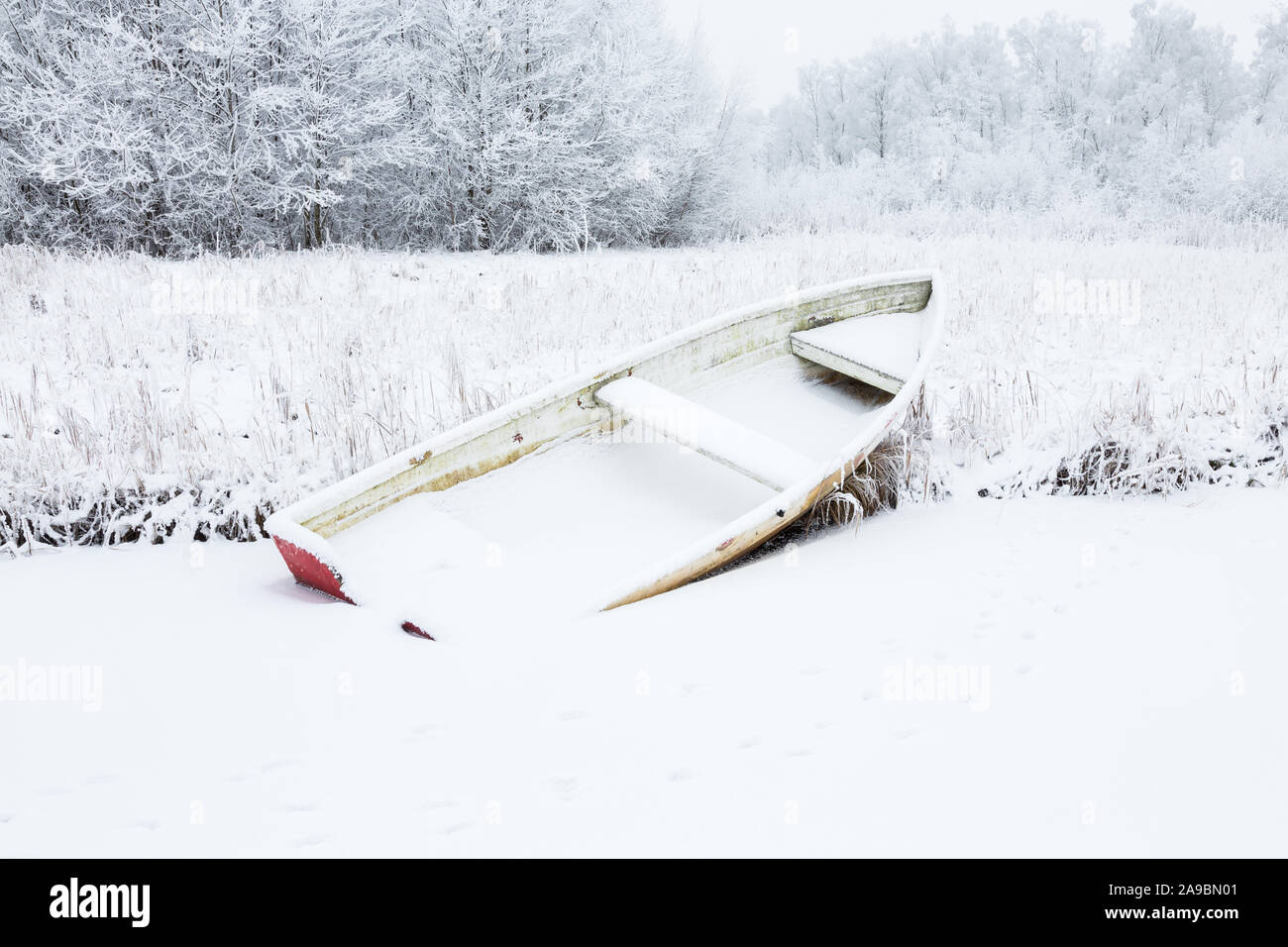 Rowing boat on the beach in winter landscape Stock Photo - Alamy