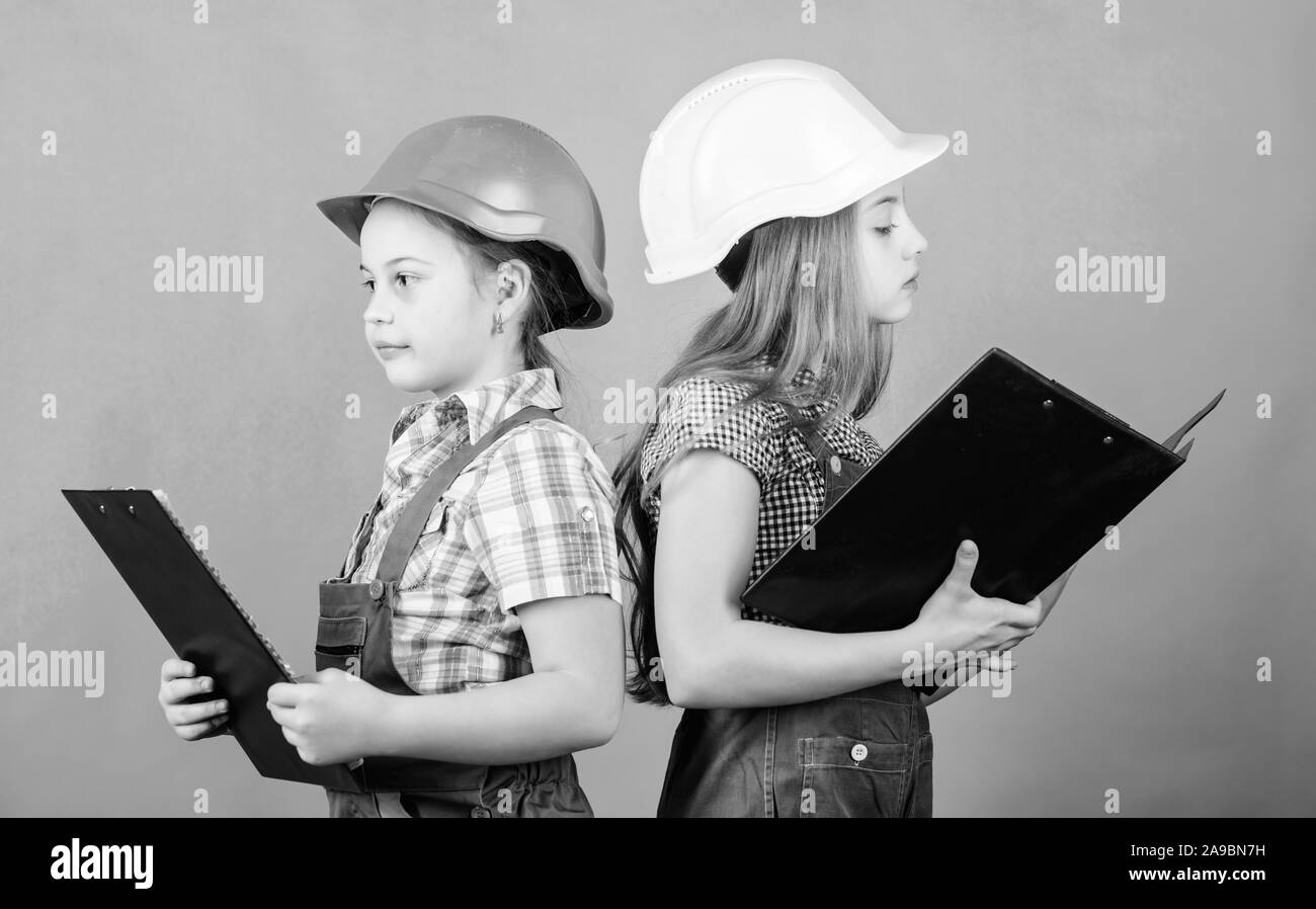 school project. small girls repairing together in workshop. Labor day ...