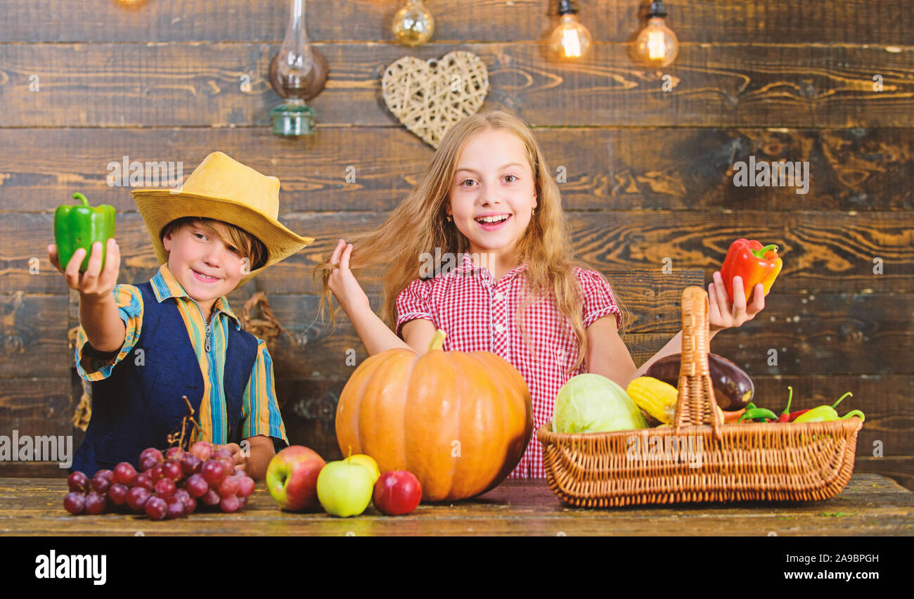 Family farm. Siblings having fun. Children presenting farm harvest ...