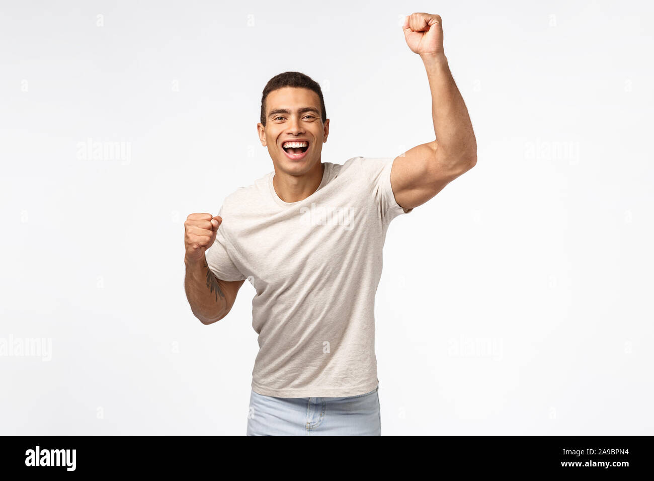 Man lift hand up in hooray motion, cheering for favorite sports team ...