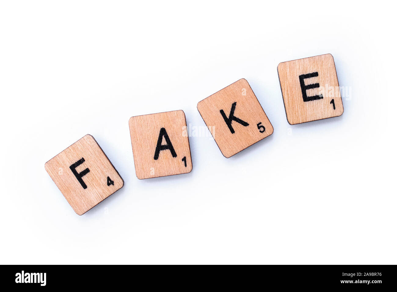 London, UK - February 13th 2019: The word FAKE, spelt with wooden ...