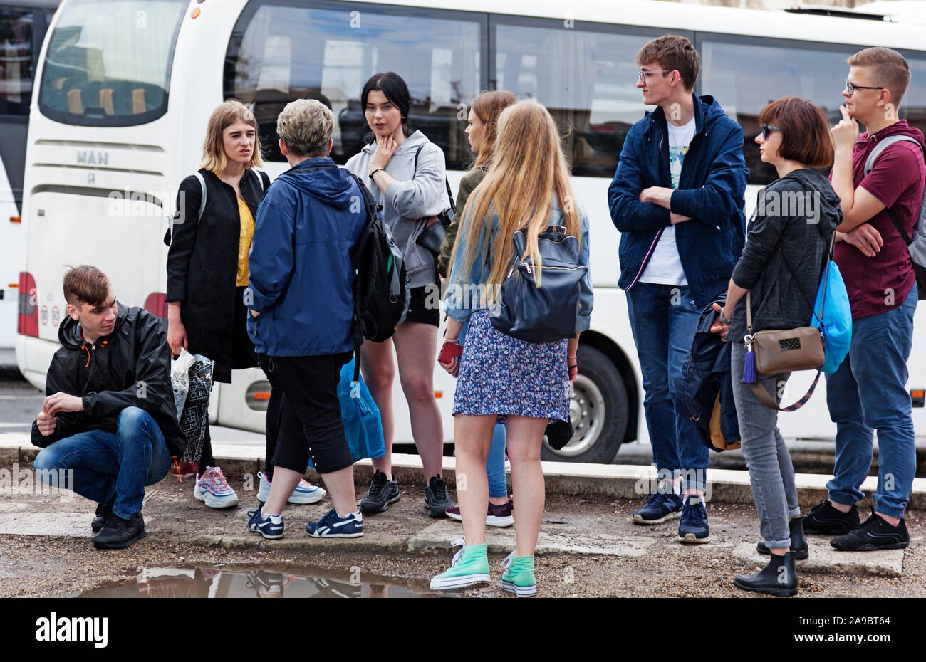 Lady waiting at bus stop hi-res stock photography and images - Alamy