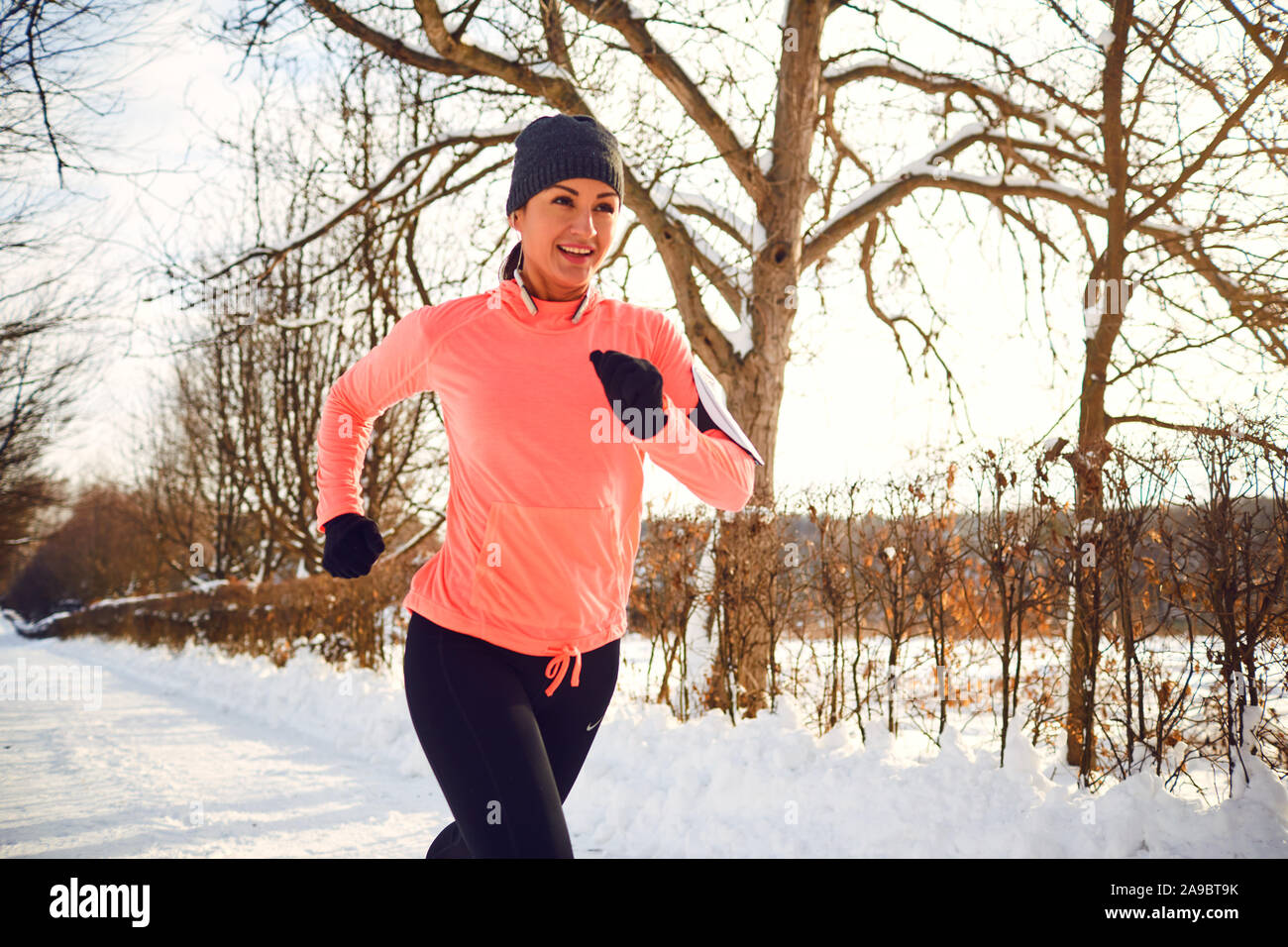 Jogging in winter forest hi-res stock photography and images - Alamy