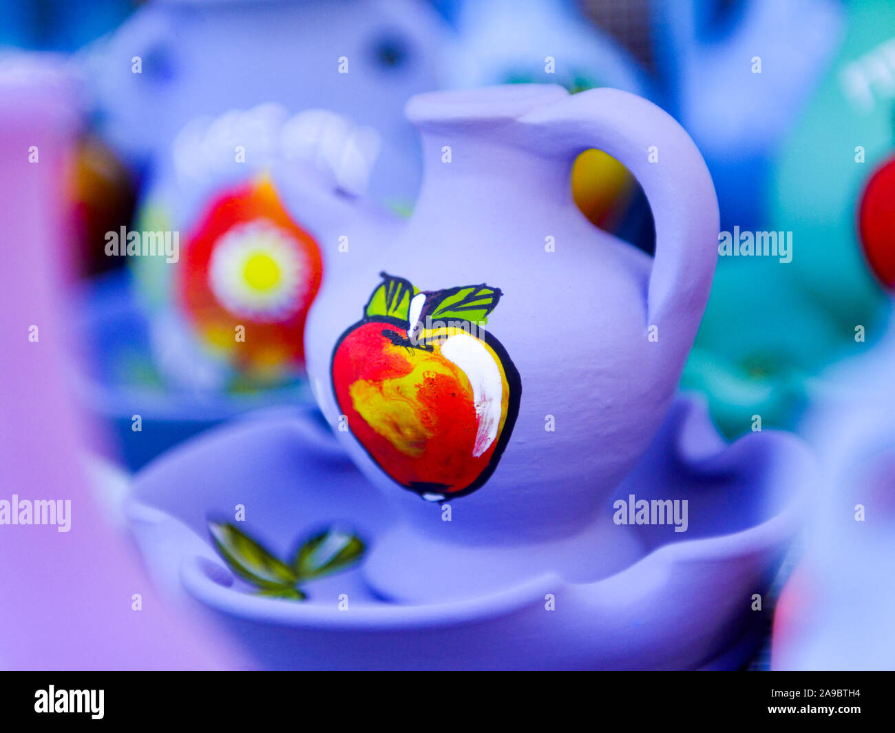 handmade pottery vessel with hand painted apple on a marketin macedonia ...