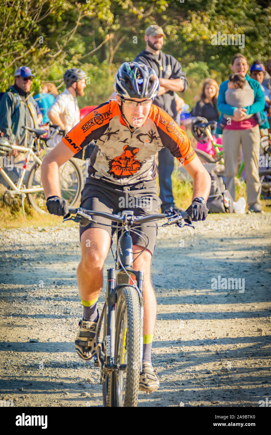 Cyclist competing in the 'King of the James' triathlon Stock Photo - Alamy