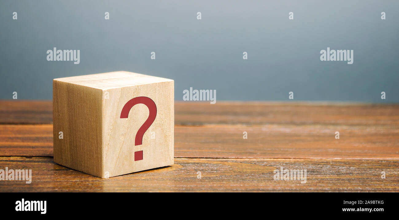 Wooden block with a question mark. Asking questions, searching for ...