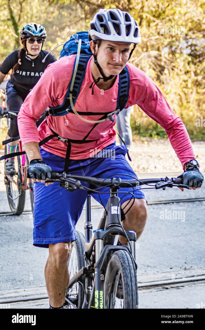 Cyclist competing in the 'King of the James' triathlon Stock Photo - Alamy