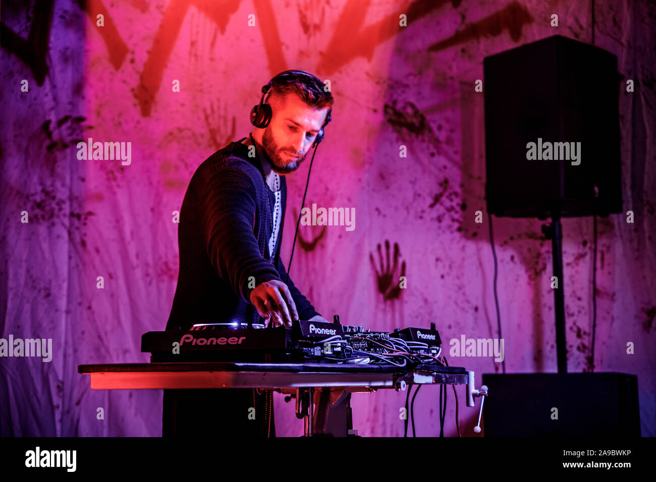 Ukraine, October 26, 2019:Young man DJ with headphones is working on ...