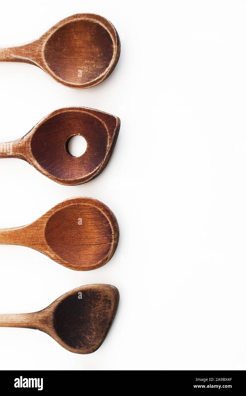 Wooden cooking spoons and white background Stock Photo - Alamy