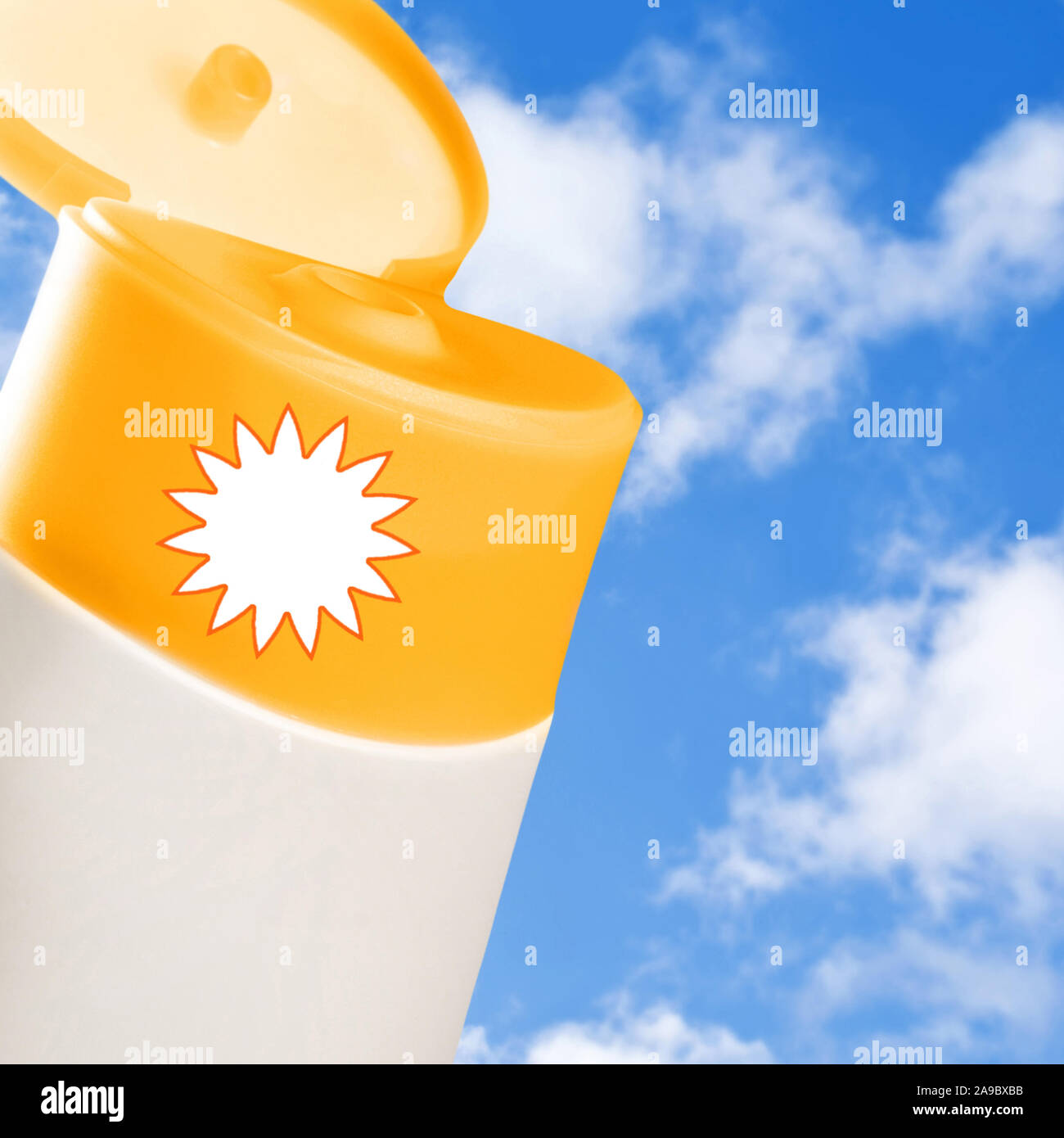 Sun protection bottle and sky background Stock Photo - Alamy