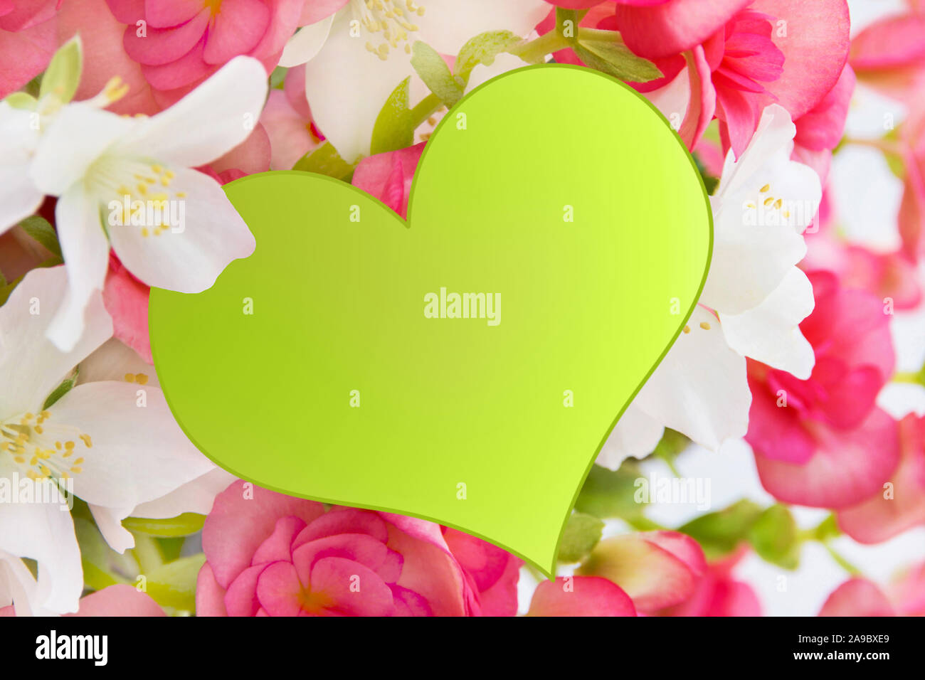 Green heart background and flowers Stock Photo - Alamy