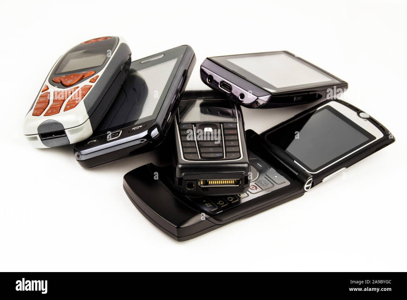 Different mobile phones against a white background Stock Photo - Alamy