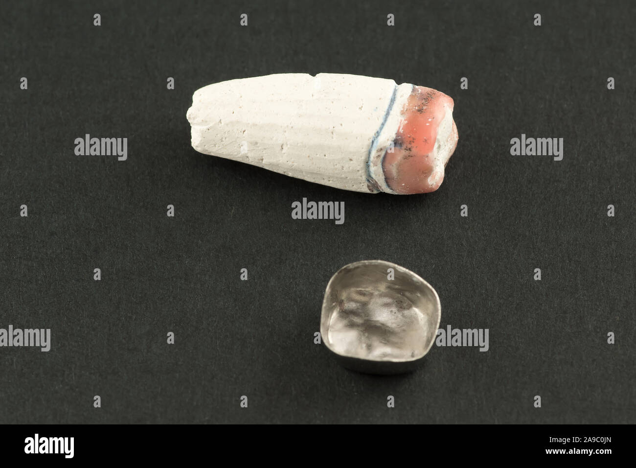 Dental metal tooth crowns isolated on white background Stock Photo - Alamy