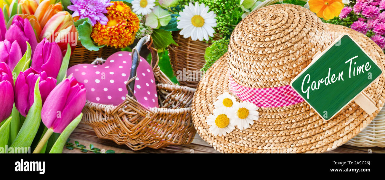 Garden time label and flowers Stock Photo - Alamy