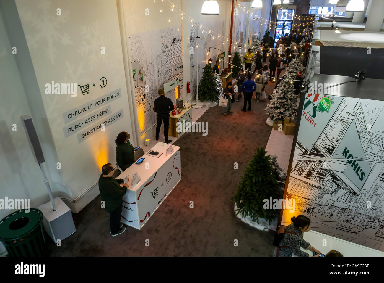 Visitors crowd the Kohl's “New Gifts at Every Turn” pop-up branding ...
