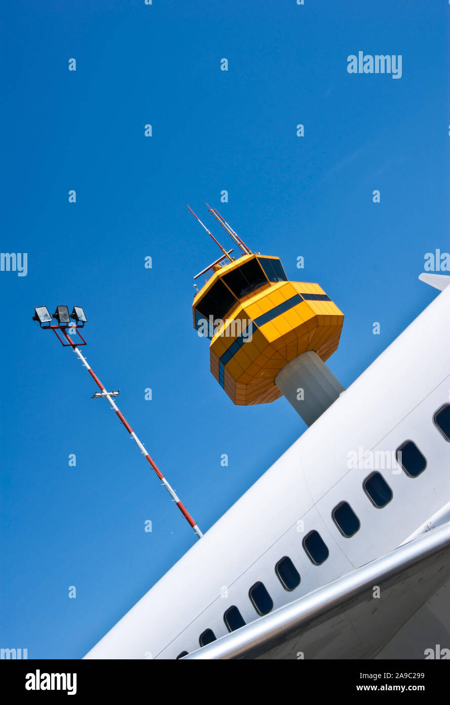 Airport tower with plane Stock Photo - Alamy