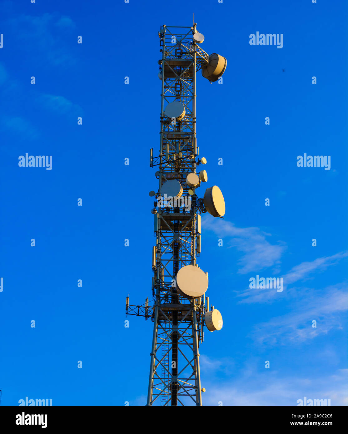 tower with control devices and antennas, transmitters and repeaters for mobile communications ...